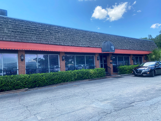 The blue awning beckons like an old friend, promising comfort food treasures behind that brick facade. Small-town breakfast magic awaits.