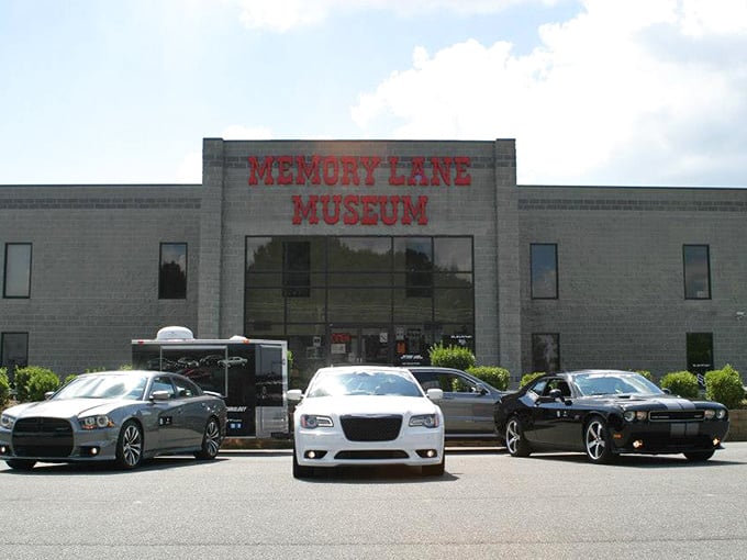 The unassuming exterior of Memory Lane Museum belies the automotive wonderland within, much like finding a V12 engine under the hood of your grandmother's station wagon.