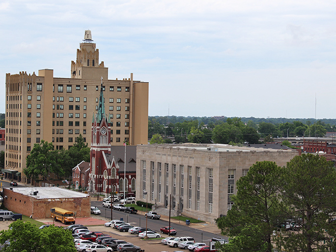 Monroe's skyline at sunset reflects in the Ouachita River like nature's own Instagram filter, showcasing the perfect blend of urban charm and natural beauty.