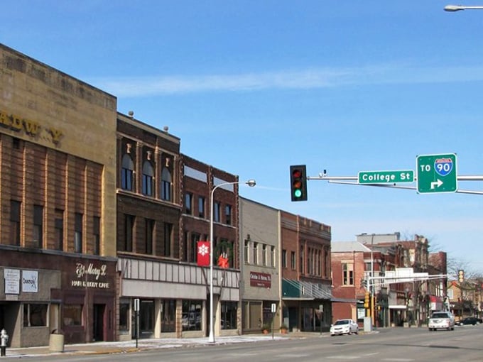 Albert Lea's historic downtown stretches beneath a perfect Minnesota blue sky, where brick buildings stand like sentinels of small-town affordability.