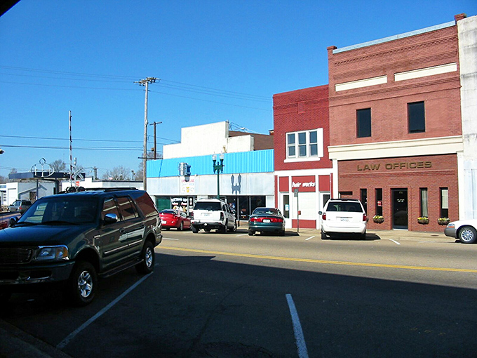 Paris's historic downtown square comes alive during market days, where locals gather under century-old shade trees for homemade treats and neighborly conversation. 