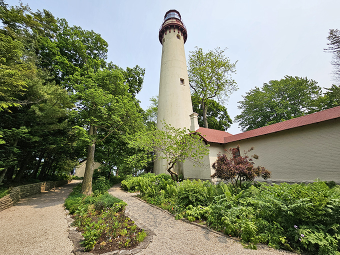 The towering Grosse Point Lighthouse stands sentinel among lush greenery, a maritime surprise in the Prairie State that's been guiding sailors since the 1870s.