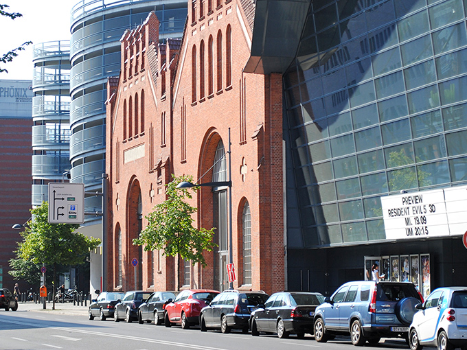 A modern urban setting with brick buildings and contemporary architecture.