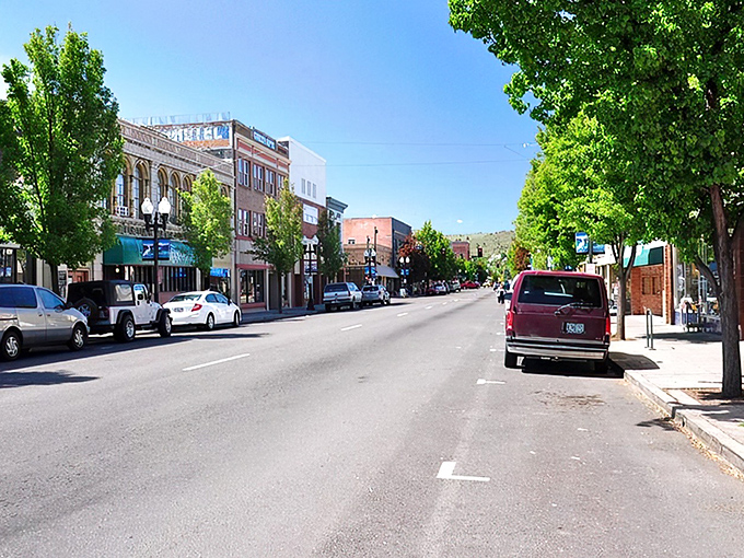 Historic brick buildings line downtown Klamath Falls, where Lindsey's Coins & Antiques invites treasure hunters to discover pieces of the past under bright blue Oregon skies.
