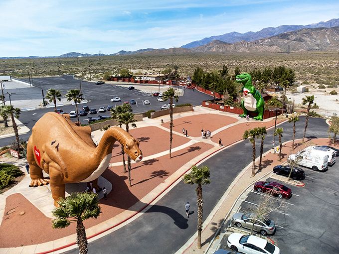 The ultimate desert mirage! Dinny the Apatosaurus and Mr. Rex stand guard over Interstate 10, welcoming weary travelers to their prehistoric playground.