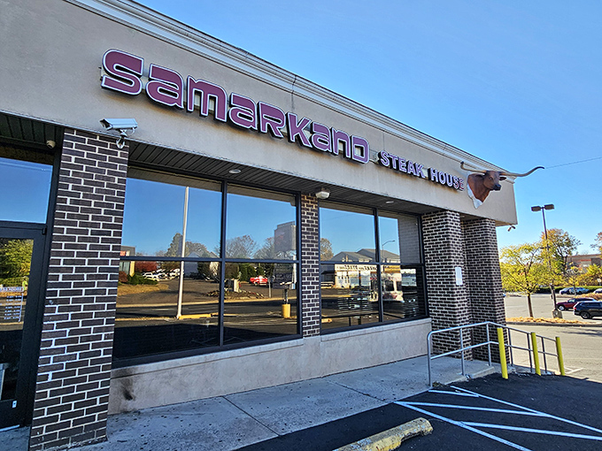The neon glow of Samarkand's sign cuts through the night like a beacon for hungry souls. This unassuming exterior hides culinary treasures within. 