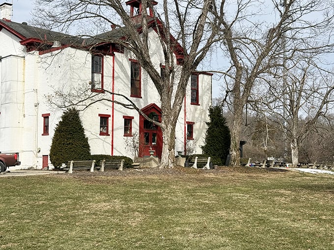 The iconic white schoolhouse with its red trim and bell tower stands as proof that sometimes the best restaurants come with homework&mdash;of the delicious variety.
