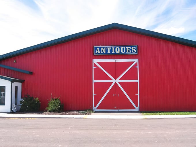 The iconic red barn exterior of Livingston Antique Outlet stands out against the Michigan sky like a beacon calling all treasure hunters home.