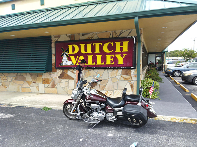 The unassuming exterior of Dutch Valley Restaurant promises "HOME COOKING" and "BELGIUM WAFFLES" – a modest declaration that understates the breakfast magic waiting inside.