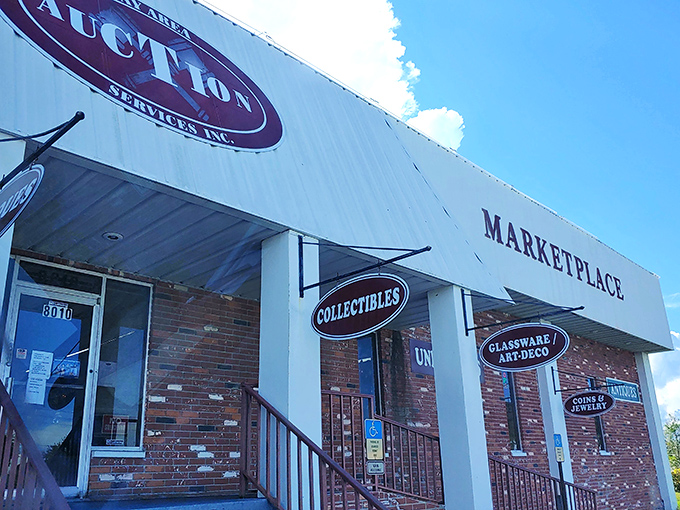 The unassuming exterior of Antique Marketplace hides a universe of treasures within, like finding a time portal disguised as a strip mall storefront.