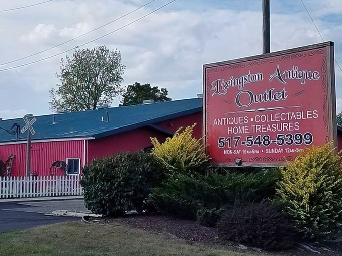 The iconic red barn exterior of Livingston Antique Outlet stands out against the Michigan sky like a beacon calling all treasure hunters home.