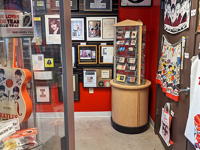 Peek through the window at Penny Lane and you'll spot treasures that would make any Beatles fan's heart skip a beat. The vibrant red walls set the perfect backdrop for Fab Four history.