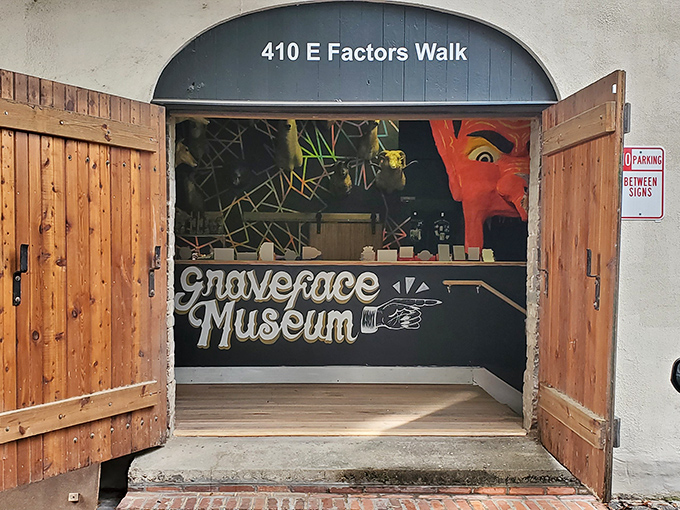 The unassuming entrance to Graveface Museum could easily be mistaken for a speakeasy or secret society headquarters. That handwritten "WE'RE OPEN" sign? Pure invitation to curiosity.