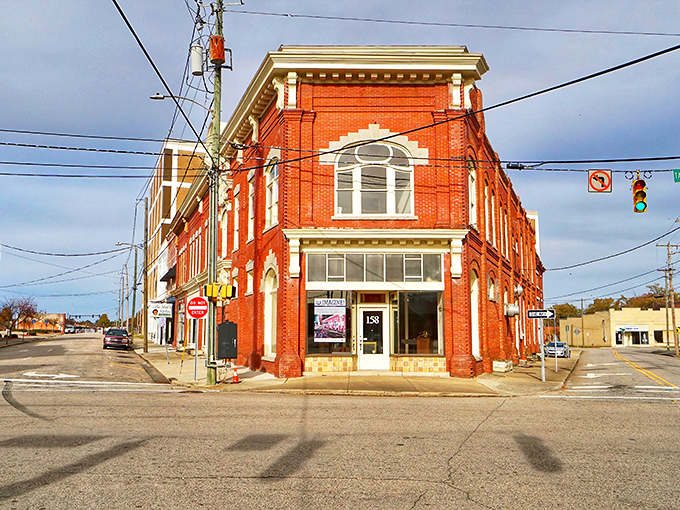 Historic brick buildings stand sentinel at this downtown intersection, where time seems to move at its own comfortable pace.