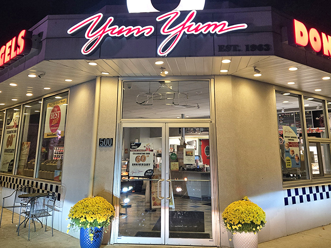 The giant pink donut beckons like a sugary lighthouse. Yum Yum's unassuming corner shop in Warminster has been stopping traffic since the Beatles were topping charts.