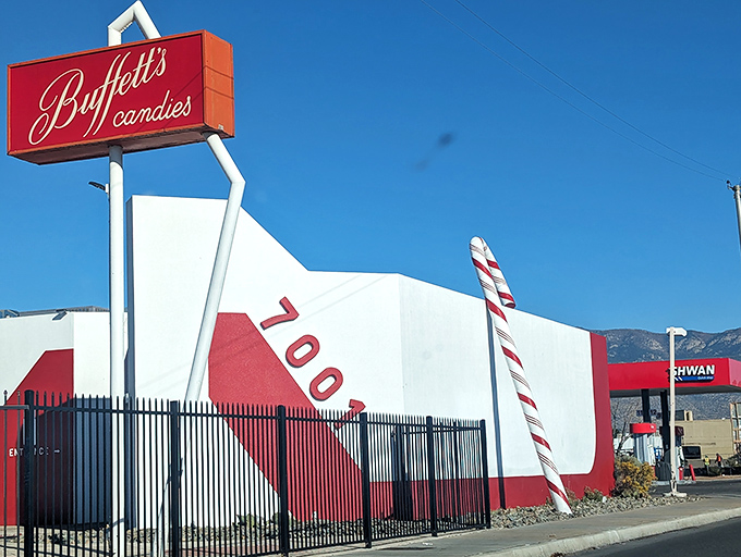 The red and white exterior of Buffett's Candies stands like a sweet mirage in the desert, promising sugary salvation to Albuquerque's candy pilgrims.