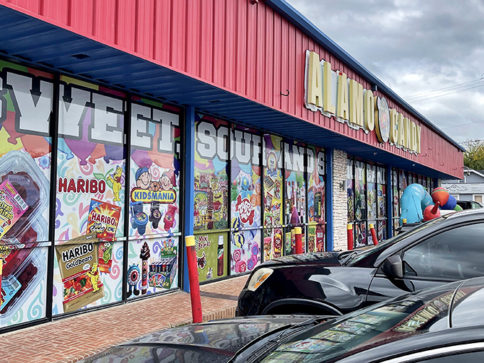 The vibrant red storefront of Alamo Candy Company stands out like a sugar rush waiting to happen. Sweet dreams are made of this!