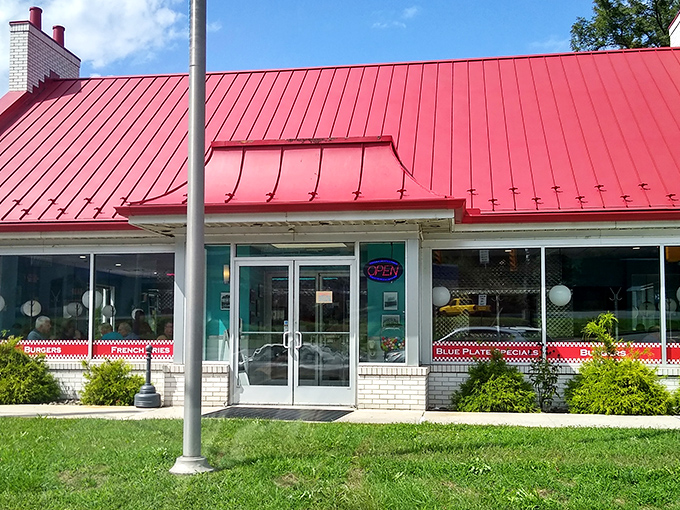 The red-roofed Pottsville Diner glows like a beacon in the night, promising comfort food salvation to hungry travelers and locals alike.