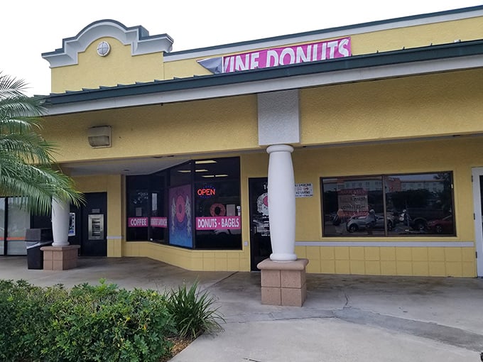 The cheerful yellow facade of Divine Donuts stands out like a sugary beacon in Fort Myers, promising sweet salvation for donut enthusiasts.