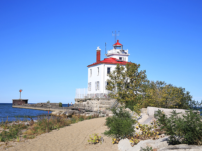 Standing proud against Lake Erie's blue canvas, this white sentinel has been photobombing vacation pictures for nearly a century. Pure Ohio maritime magic.