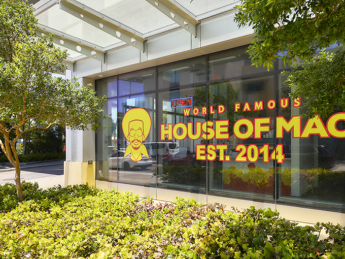 The neon glow of comfort food paradise beckons from Miami's urban landscape, promising cheesy dreams come true.