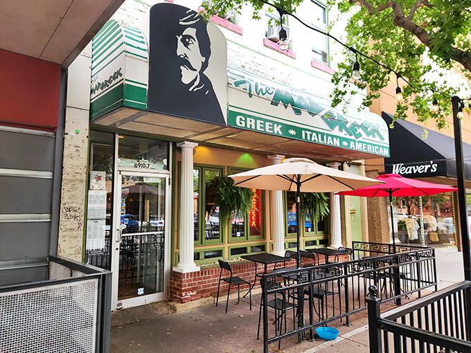 The Mad Greek's inviting storefront beckons with classic white columns and cheerful patio umbrellas&mdash;Massachusetts Street's little slice of Athens awaits your discovery.