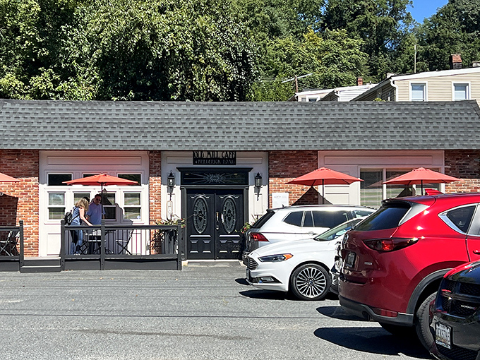 The unassuming brick exterior of Old Mill Cafe beckons with its elegant black doors and cheerful red umbrellas&mdash;like a secret breakfast society waiting to initiate you.