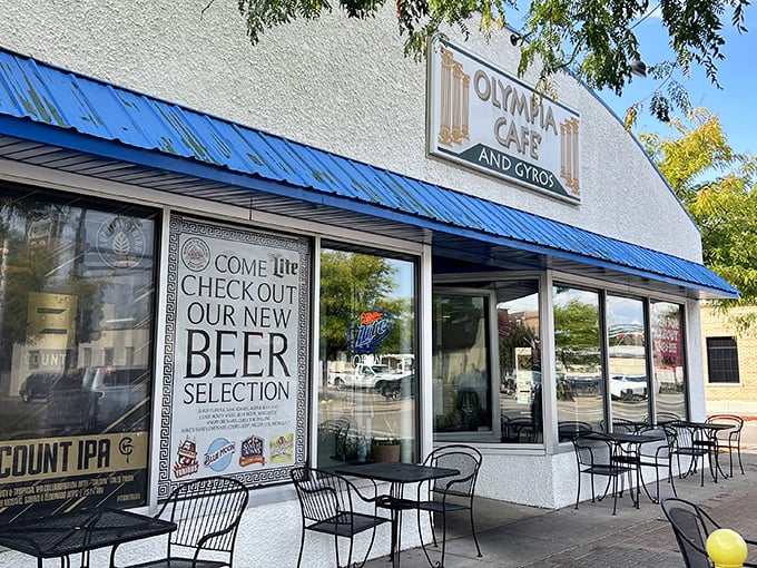 The blue-trimmed facade of Olympia Cafe beckons like a Mediterranean mirage in suburban Osseo, promising Greek delights and all-day breakfast adventures.