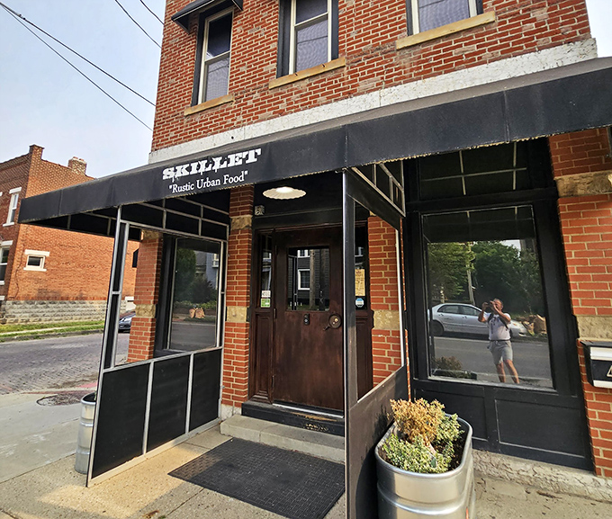Skillet's unassuming brick exterior in Columbus hides culinary treasures within. The black awning whispers promises that the food inside shouts from the rooftops.