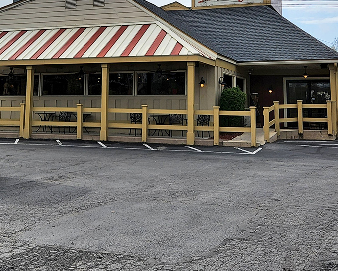 The red and white awning beckons like a lighthouse for hungry travelers. This unassuming exterior houses seafood treasures that rival coastal establishments.