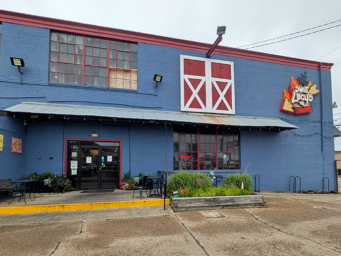 The bright blue barn-like exterior of Sweet Lucy's stands out like a barbecue beacon in Northeast Philly. The red accents practically scream "good things are smoking inside!"