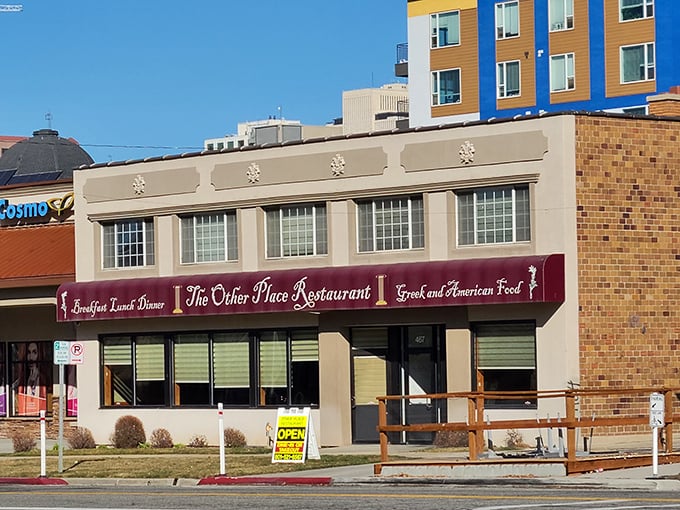 The unassuming exterior of The Other Place Restaurant proves that culinary treasures often hide behind modest facades. Greek greatness awaits inside!