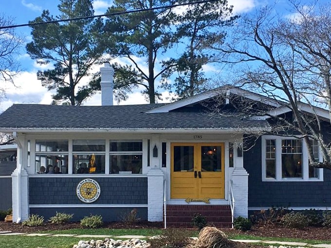 Those sunny yellow doors aren't just welcoming you to breakfast&mdash;they're practically daring you not to smile. Cottage charm with a side of morning promise.