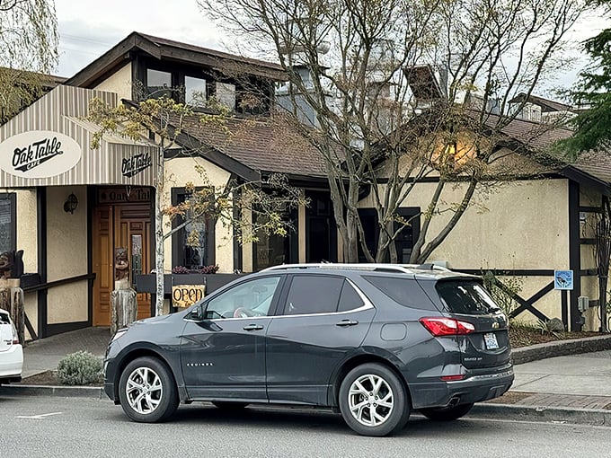 The timber-framed facade of Oak Table Cafe welcomes you like a breakfast hug. Those hanging flower baskets aren't just pretty&mdash;they're signaling that good taste awaits inside.