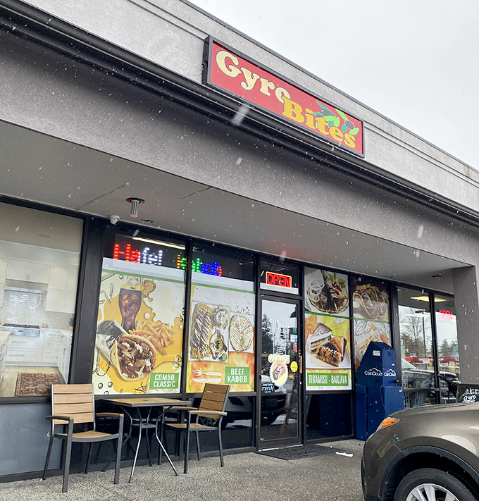 The colorful Gyro Bites sign beckons like a Mediterranean lighthouse in a sea of strip mall sameness. No pretension, just promise. 