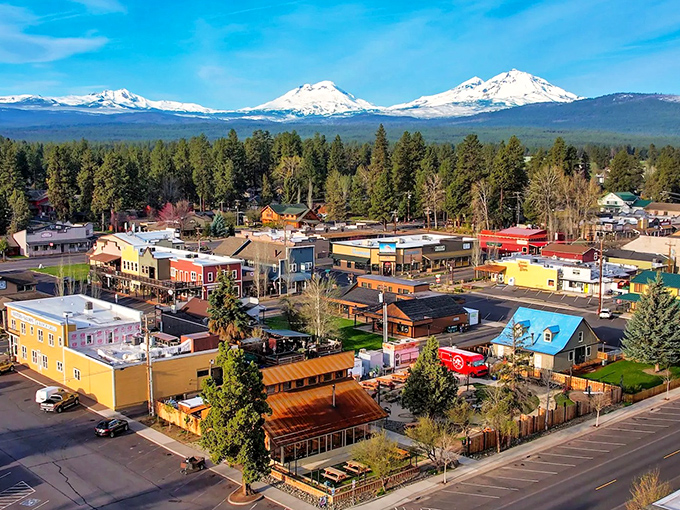 Sisters' Western-themed storefronts stand like a movie set against the breathtaking backdrop of snow-capped Cascade peaks, proving small towns can deliver big views.