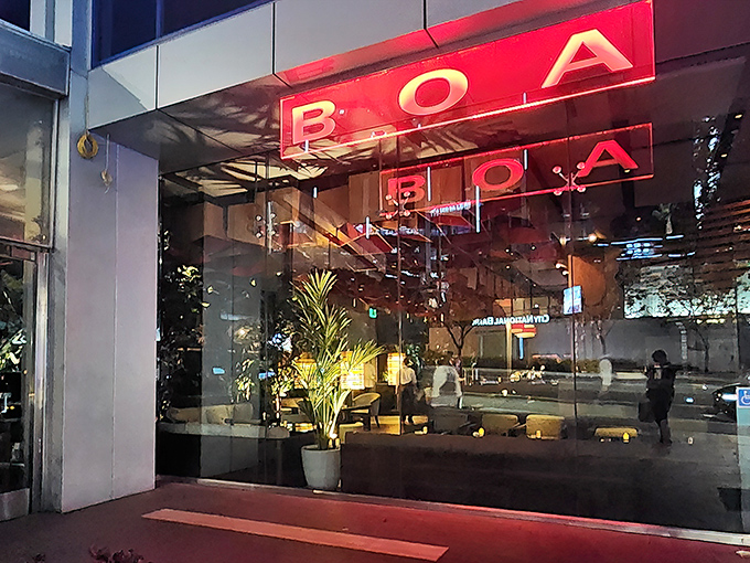 The iconic red exterior of BOA Steakhouse glows like a beacon on Sunset Boulevard, promising carnivorous delights within these stylish walls.