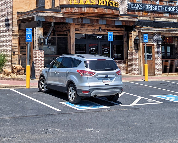 The rustic brick-and-wood exterior of Fort Worth Steakhouse promises authentic Texas flavor without pretense. Meat paradise awaits beyond those doors.