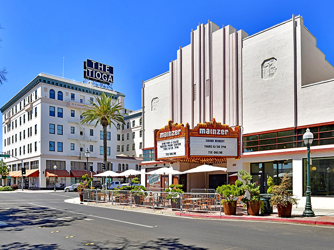 The historic El Capitan Hotel stands tall against California's endless blue sky, a testament to Merced's blend of affordability and architectural charm.