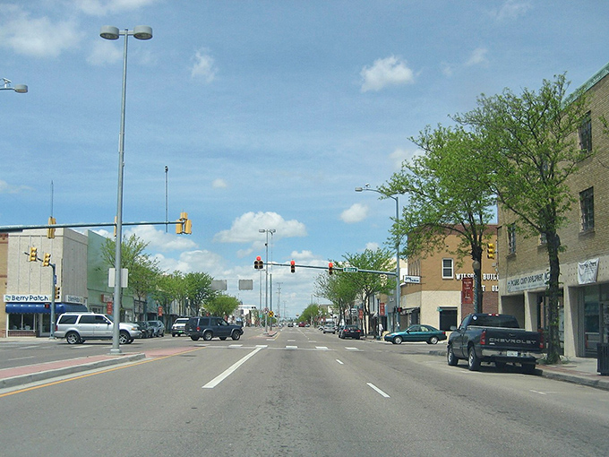 Main Street Lamar welcomes visitors with its classic small-town charm. Those red banners aren't just decorative&mdash;they're practically waving "affordable living this way!"