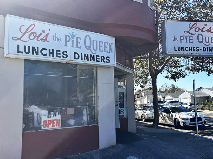 The unassuming corner facade of Lois the Pie Queen stands like a culinary lighthouse in Oakland, promising comfort food treasures to those in the know.