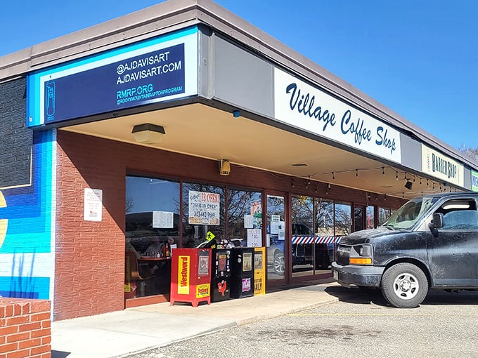 The iconic Village Coffee Shop sign stands proudly against the Colorado blue sky, promising breakfast salvation to hungry Boulder residents.