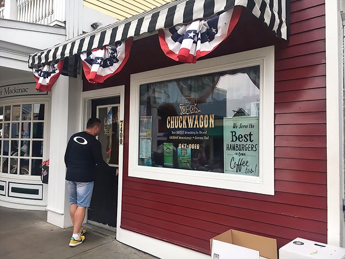 The little red diner that could! The Chuckwagon's modest exterior with its classic striped awning promises big flavors inside this Mackinac Island gem.