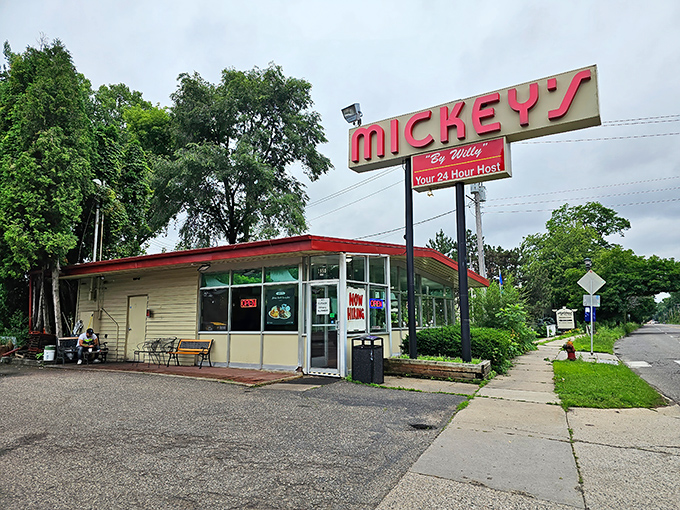 The red-roofed beacon of breakfast hope stands proudly against Minnesota's blue sky, promising comfort food that transcends time.