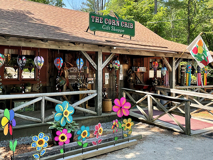 The Corn Crib gift shop welcomes you with rustic charm and colorful flower decorations. Your maple syrup journey begins before you even reach the pancakes!