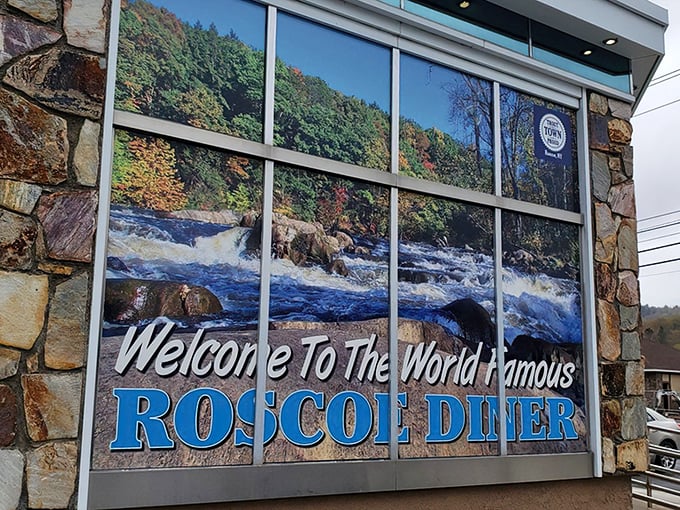 The stone facade and iconic blue signage of the "World Famous" Roscoe Diner stands as a beacon for hungry travelers along Route 17, promising comfort food salvation ahead.