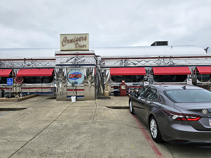 The gleaming stainless steel exterior of Cruisers Diner shines like a beacon of hope for hungry travelers. This chrome time capsule promises delicious nostalgia inside. 