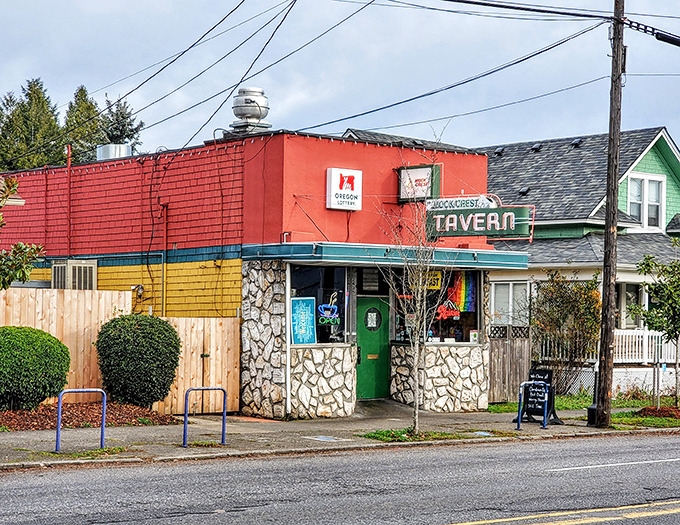 The iconic stone facade and vintage neon sign of Mock Crest Tavern stands as a beacon for breakfast seekers in North Portland.