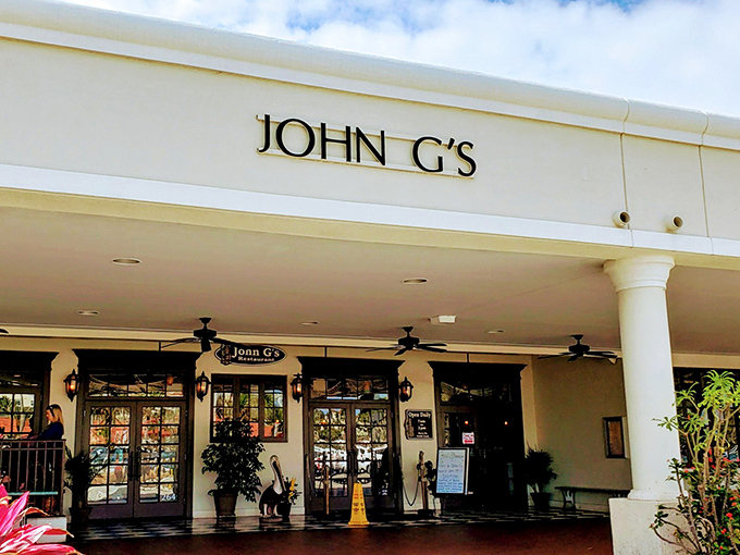 The line forms early at John G's, where patient food pilgrims gather under Florida sunshine. Worth every minute of the wait!