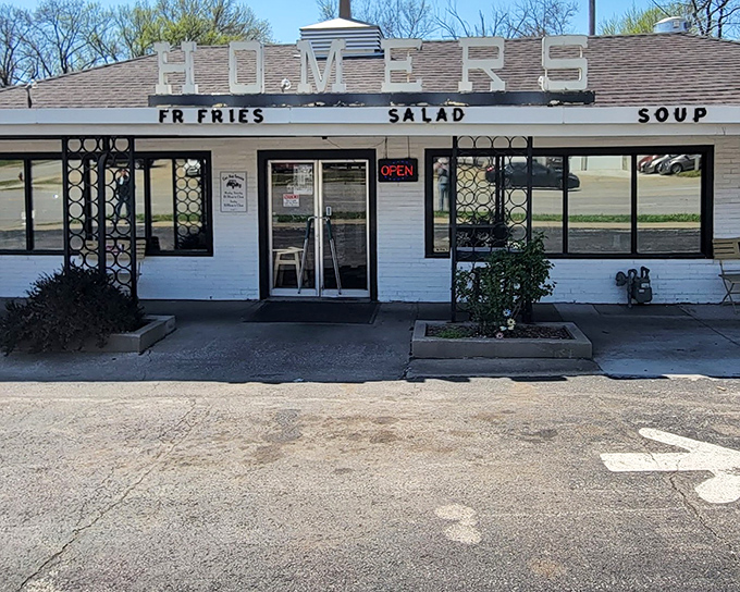 The classic diner beckons with its vintage signage proudly announcing "BEEF HAMBURGERS" &ndash; like a time portal to simpler, deliciously unpretentious days.